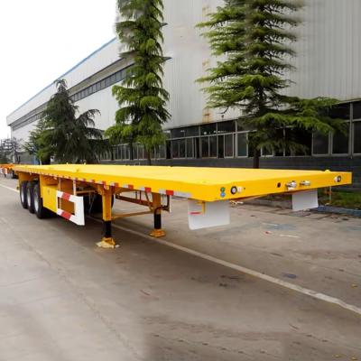 China Maximale nuttige lading 20T-80T 40 ft 2 3 assen platgelegen half-aanhanger voor langeafstandsvervoer Te koop