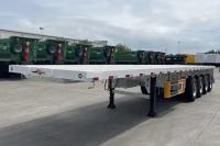 China Customized 3 Axles 40FT Container Flat Bed Semi Truck Trailers with Max Payload 100tons for sale