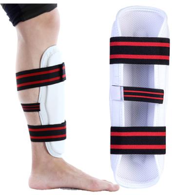 China Custom LOGO high quality sparring gear protective shin guards for taekwondo shin protector PU+EVA+Sponge for sale
