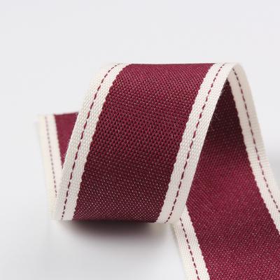 China Cinturón de poliéster de borde cosido de 6 mm a 40 mm, rodillos de cinta de poliéster verde rojo en venta