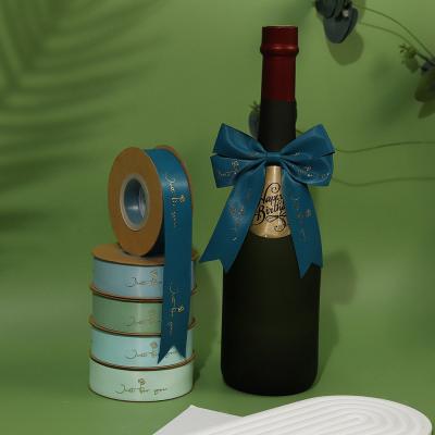 China Folha de ouro personalizada estampada fita satinada de poliéter para embalagem de presentes à venda