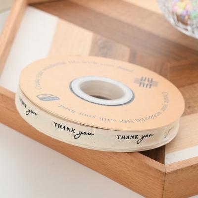 Cina 13mm Logo all'ingrosso Nastro di cotone Stile letterario Imballaggio di fiori Scatola regalo Decorazione Nastro Torta Bouquet in vendita