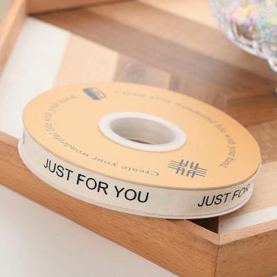 Cina 13mm Logo all'ingrosso Nastro di cotone Stile letterario Imballaggio di fiori Scatola regalo Decorazione Nastro Torta Bouquet in vendita