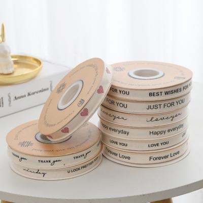 Cina 13mm Logo all'ingrosso Nastro di cotone Stile letterario Imballaggio di fiori Scatola regalo Decorazione Nastro Torta Bouquet in vendita