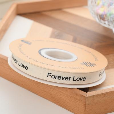 Cina 13mm Logo all'ingrosso Nastro di cotone Stile letterario Imballaggio di fiori Scatola regalo Decorazione Nastro Torta Bouquet in vendita