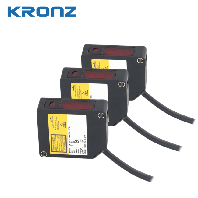 Industrial photoelectric sensor front view showing laser diode and housing