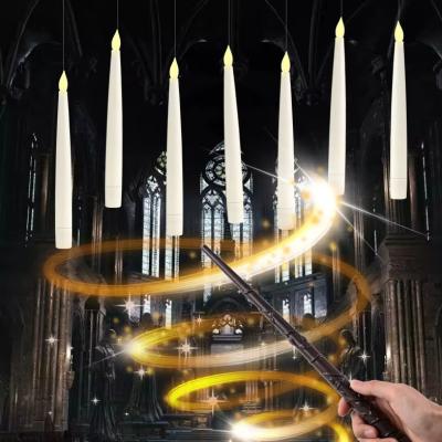 China Flameless Taper Electric Battery Operated Artificial LED Floating Candles With Magic Wand Remote for sale