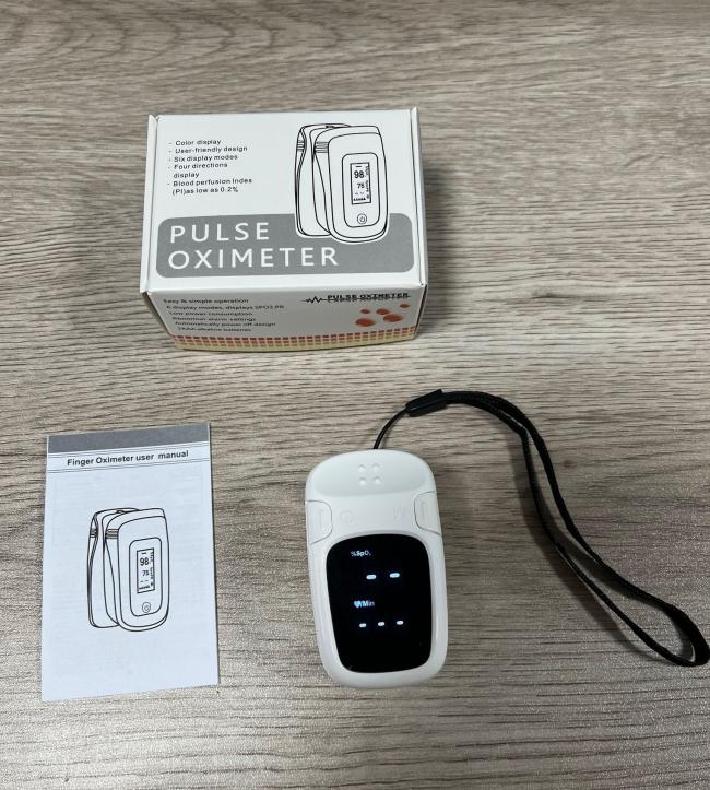 Finger Pulse Oximeter in use with finger inserted