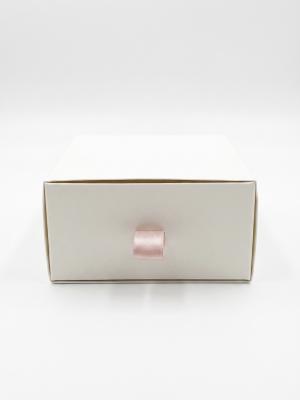 China Pure white matte cardboard drawer box with pink ribbon handles. Simple folding gift box customization. for sale