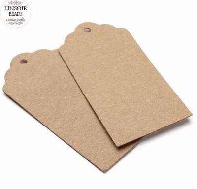 China Professional Custom Clothing Labels Brown Kraft Paper Clothing Hang Tags for sale
