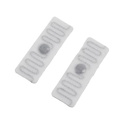 Chine Sécurité du supermarché RFID étiquette souple COB Matériau lavable 70 X 15 mm Code de puce personnalisable à vendre