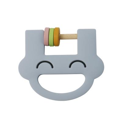 Cina Il crepitio sveglio Teether del silicone dei giocattoli dei bambini del silicone del fronte di sorriso con personalizza il ODM dell'OEM di logo in vendita