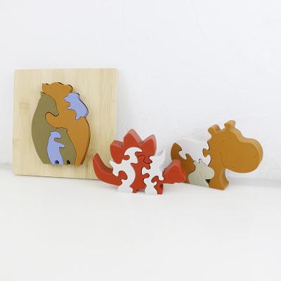 Cina Personalizzi il puzzle del silicone, i puzzle infantili 3D con la base di bambù di legno in vendita