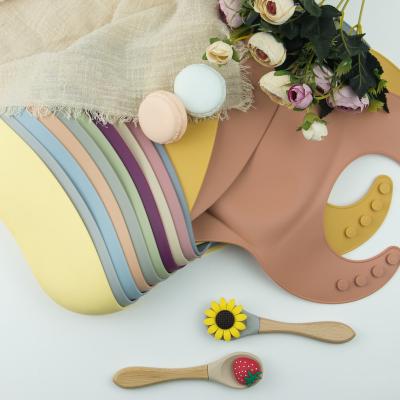 Cina 4 bene durevole molle impermeabile del silicone dei bottoni BPA della busbana francese libera del bambino regolabile in vendita