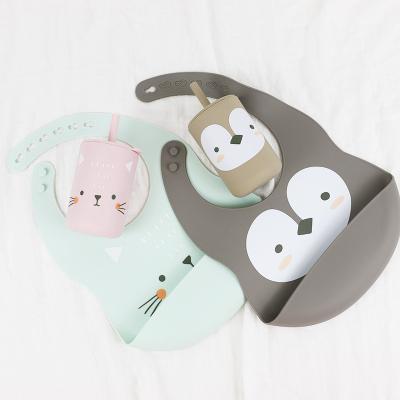 China Custom Soft And Comfortable Material Silicone Baby feeding Bib with Cute Cartoon Design for sale