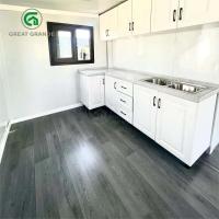 China 20ft Foldable Tiny House Manufacturer Customized Dark Gray Wall Panels Frame Rainproof Windproof for sale