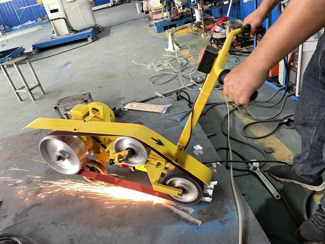 Close-up view of welded joints grinder handle polisher