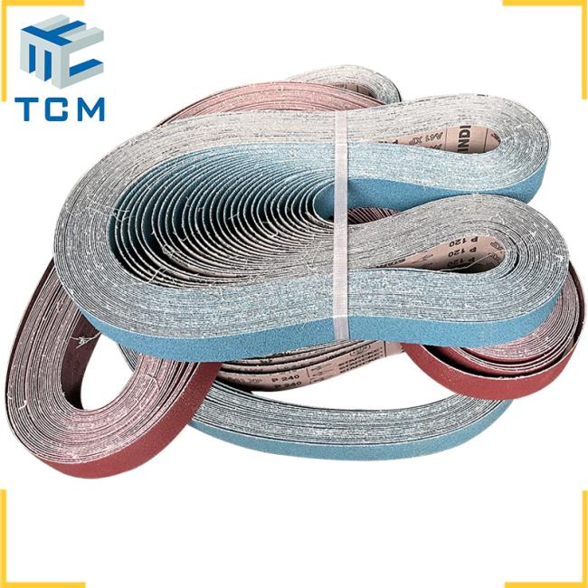 Abrasive sanding belts in use on steel tank polishing machine