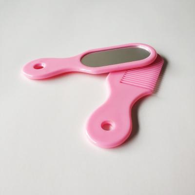 China Mini size cosmetic pocket makeup mirror with handle,children comb with handle for sale