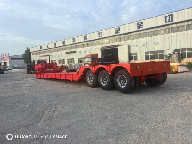 Rear perspective of Lowbed Trailer with loading ramp