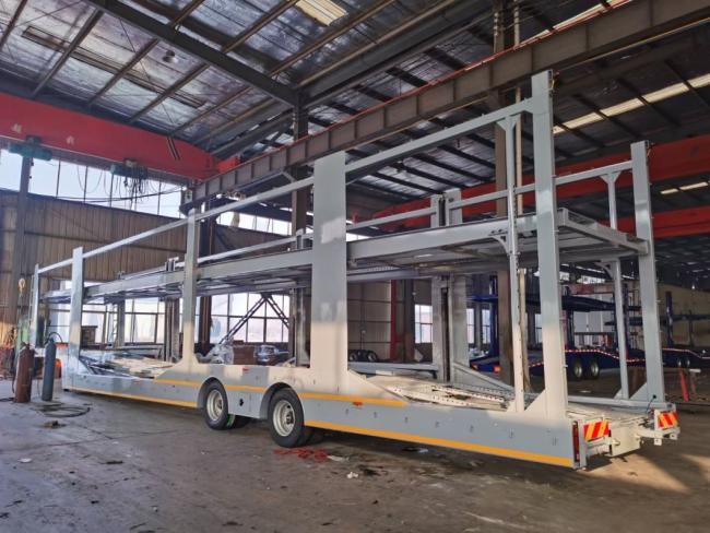 Side view of AND car carrier trailer showing loading capacity