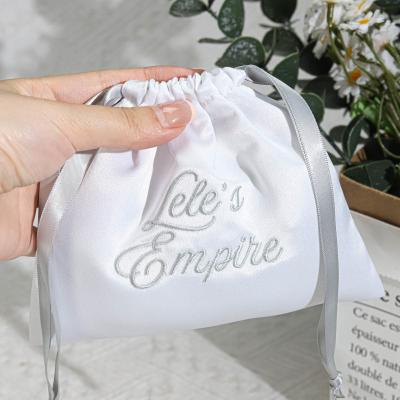 China High End White Satin Cosmetic Perfume Packing Pouch Custom Embroidery Logo Satin Drawstring Dust Bag for sale