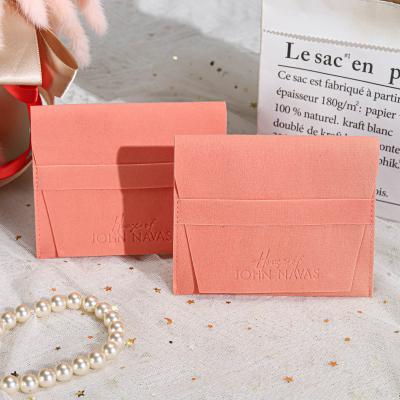 China 100pcs High Quality Suede Jewelry Packing Pouch With Emboss Logo Orange Velvet Bracelet Earrings Gift Envelope Bag for sale