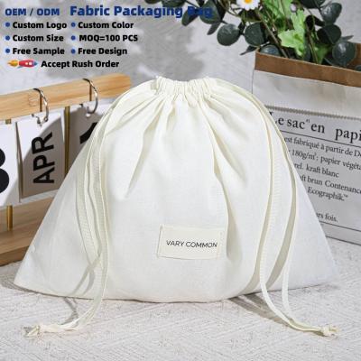 China Reusable Organic Muslin Cotton Drawstring Dust Bag With Fabric Label Custom Cotton Cosmetic Underwear Storage Drawstring Bag for sale