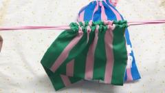 green and blue polyester drawstring pouch