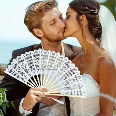China New Arrival 27cm Lace Bamboo Folding Hand Fan Wedding Gift Fan with Tassel for sale