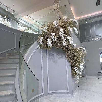 China High Strength Modern Steel Stringer Staircase with Super White Tempered Glass Railing for sale