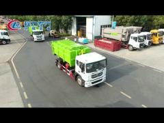 Autocarro compattatore HOWO a 3 assi con gancio di sollevamento e gru XCMG da 3 tonnellate