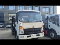 Autocarro Sinotruck Howo con cassone ribaltabile lato destro, compattatore robusto per rifiuti