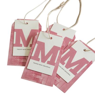 China Luxury Garment Swing Tags Custom Plastic Hang Tags For Clothing for sale