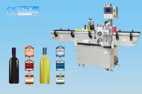 China Servo 60bpm Automatic Round Bottle Labeling Machine 100mm Width Self Adhesive for sale