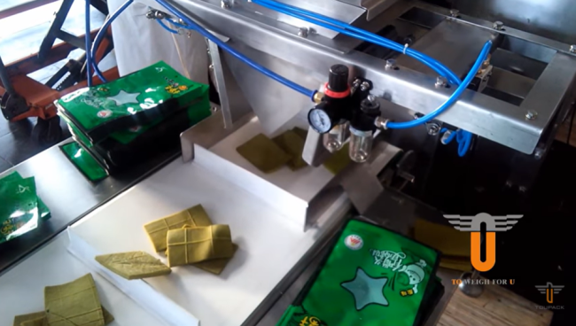 Close-up view of TOUPACK weighing machine components
