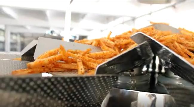 Close-up view of weighing hoppers and control panel