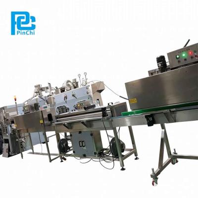 China Automatic 600ml PET Bottle Shrinking Package Machine With 304 Stainless Steel Construction For Food And Beverage Industries for sale