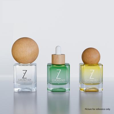 China New 30ml Square Essential Oil Glass Bottles Thick-bottomed Designs Leak-proof Bamboo Glass Dropper bottles High Quality Cosmetic glass bottles for Essential oil packaging solutions for sale