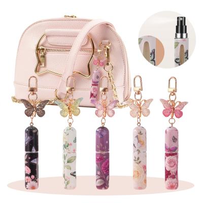 China New Popular 5ml Fragrance Bottles Fine Mist Spray Cosmetic Perfume Samples Aromatherapy Bottles Portable Perfume Bottles Travel Perfume Vials with butterfly-shaped keychain cute girly perfume bottles for sale