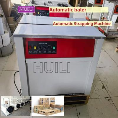 China PLC Controlled Automatic Strapping Machine Continuous Mode Carton Box Strapping Machine for sale