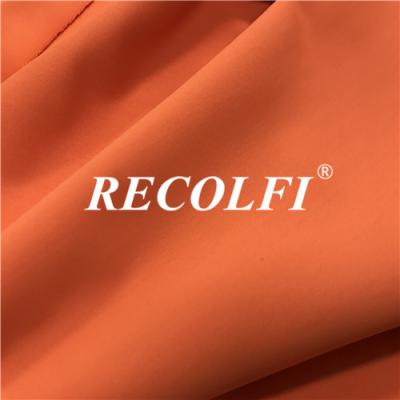 China Hoge Gerecycleerde Spandex de Stoffen Oranje Kleur van Upf Classificatie voor Uiteindelijke Activewear Te koop