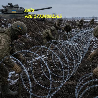 China Galvanized Razor Barbed Wire With Concertina Style Loops And Sharp Blades For Security Barriers And Easy Installation In Various Settings for sale