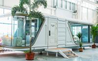 China Eco Friendly Customized Prefab Capsule House 11.5M x 3.3M Mobile Tiny House for sale