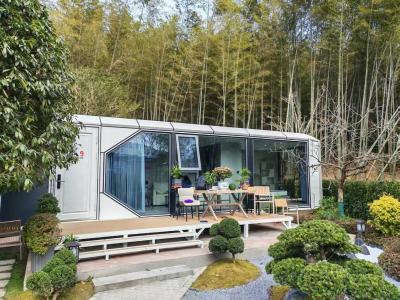 China Luxury Modern Prefabricated Capsule House With Balcony Galvanized Steel Frame 11.5*3.4*3.4m for sale