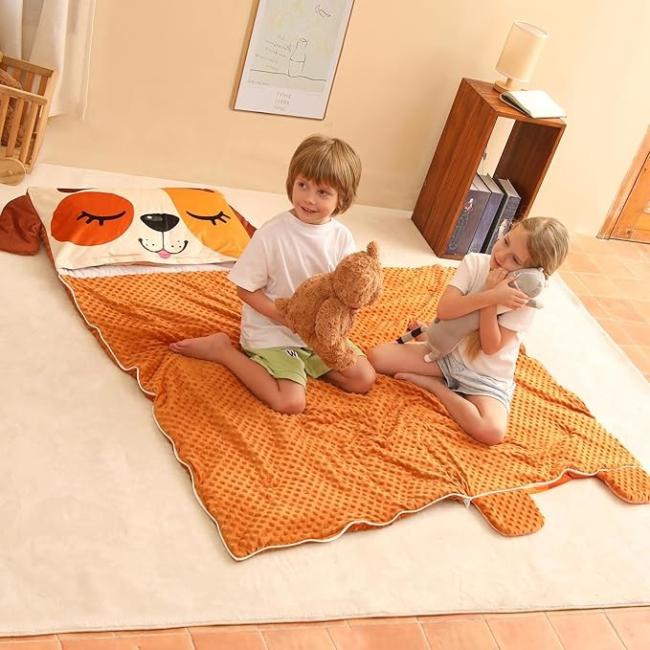 Portable toddler nap mat with dog design, folded and packed in carrying case