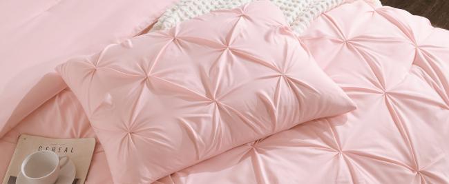 Pink comforter set packaged as a gift