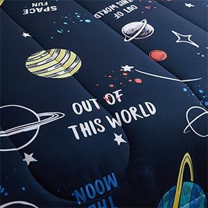 Bedroom setup with space rocket bedding