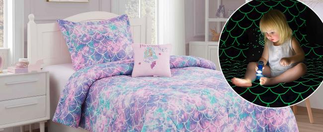Mermaid glow-in-the-dark comforter set displayed on a bed