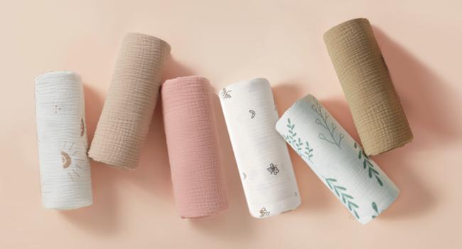 Breathable cotton bassinet sheets in flower and pink patterns